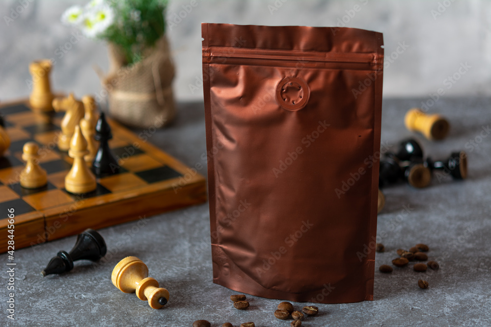 Blank coffee packaging with degassing valve, coffee beans and chess, coffee packaging mockup ...