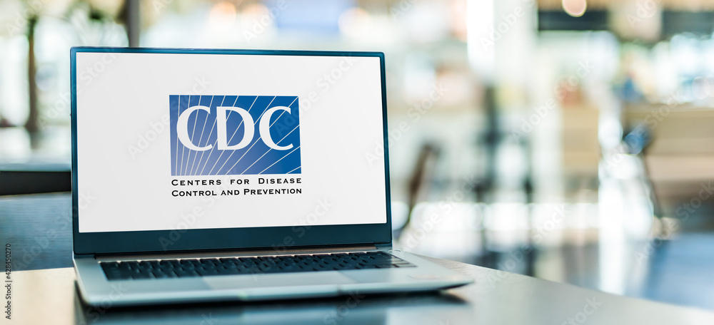 Laptop displaying logo of U.S. CDC Stock Photo | Adobe Stock