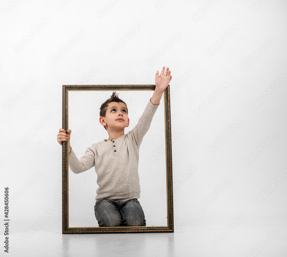 boy with a frame for a portrait on a white background Stock Photo ...