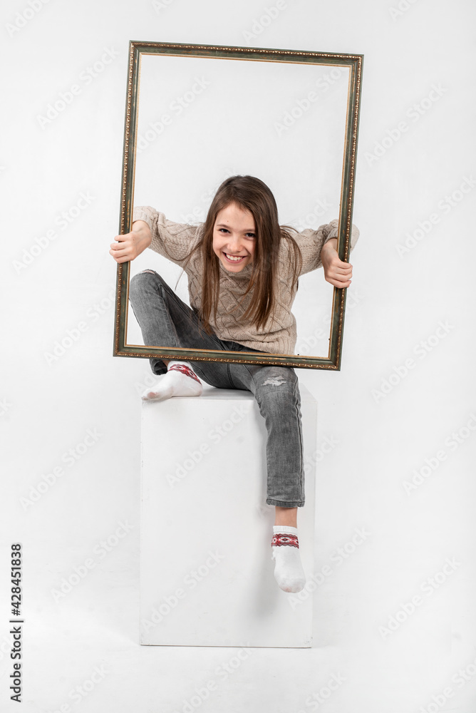 girl with a frame for a portrait on a white background Stock Photo ...