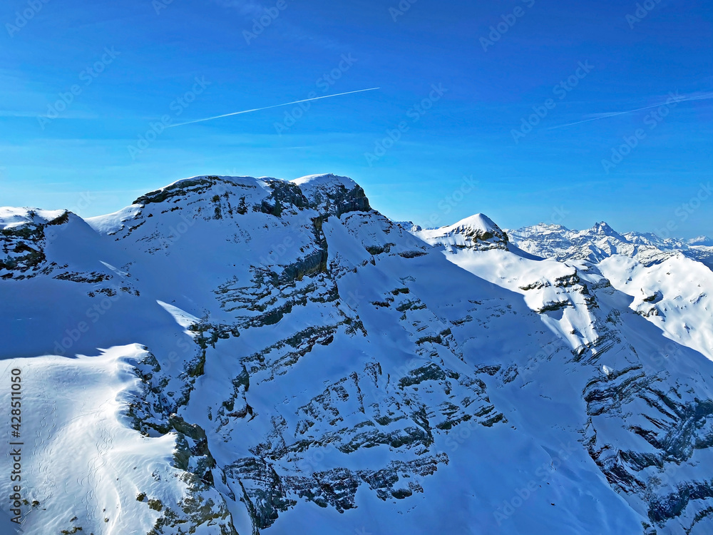 Snowy alpine mountain peaks Le Sommet des Diablerets and Tête Ronde ...
