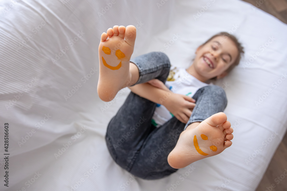 Close up of little girl's feet painted with smiles. Stock Photo | Adobe ...