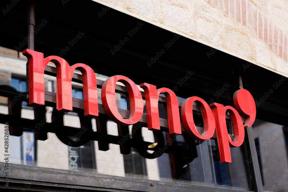 monop text brand and sign logo of shop supermarket store facade in city ...