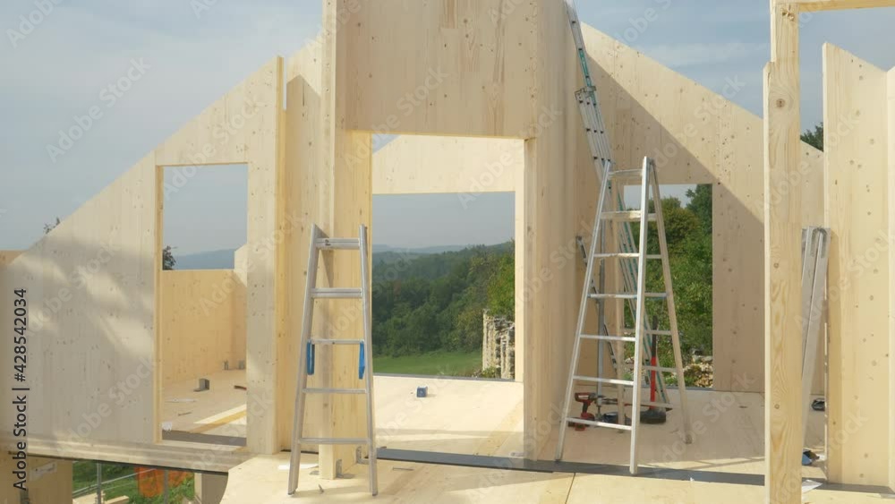 CLOSE UP: Aluminum ladders are scattered around the top floor of a CLT ...