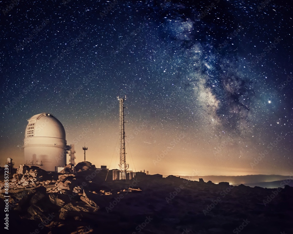 astronomical observatory dome investigating sky with the milky way on a ...