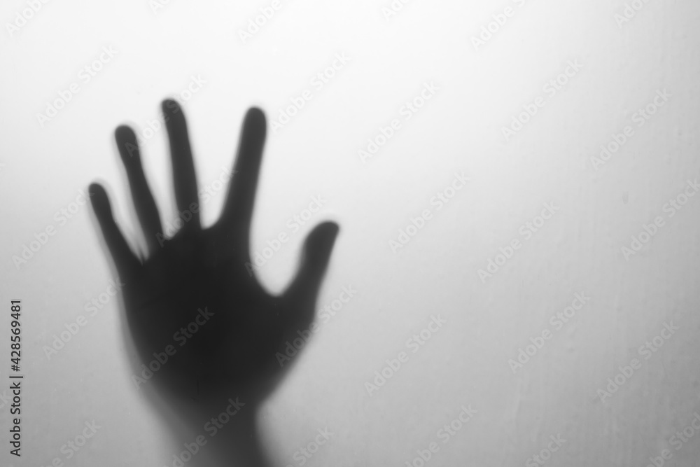 shadow human hand or people plam on window frosted glass or door for ...