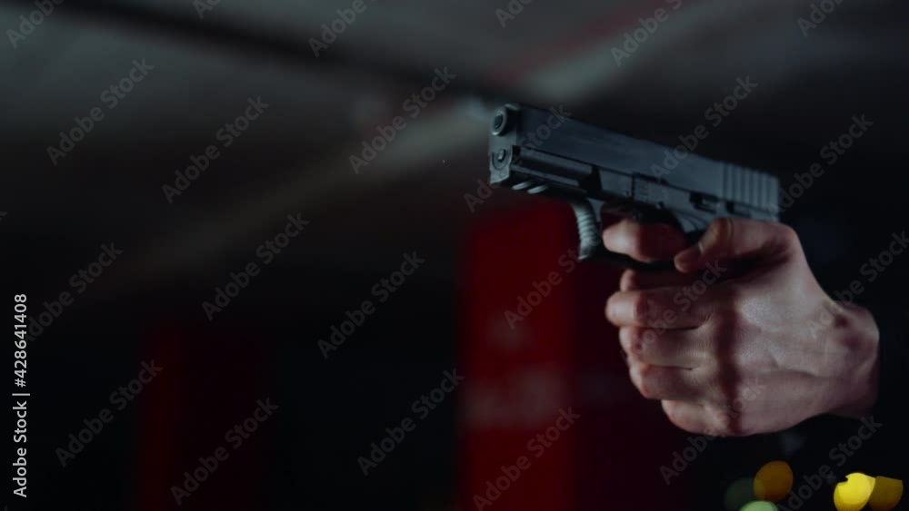 Man hands shooting with gun. Police officer pushing finger on trigger ...