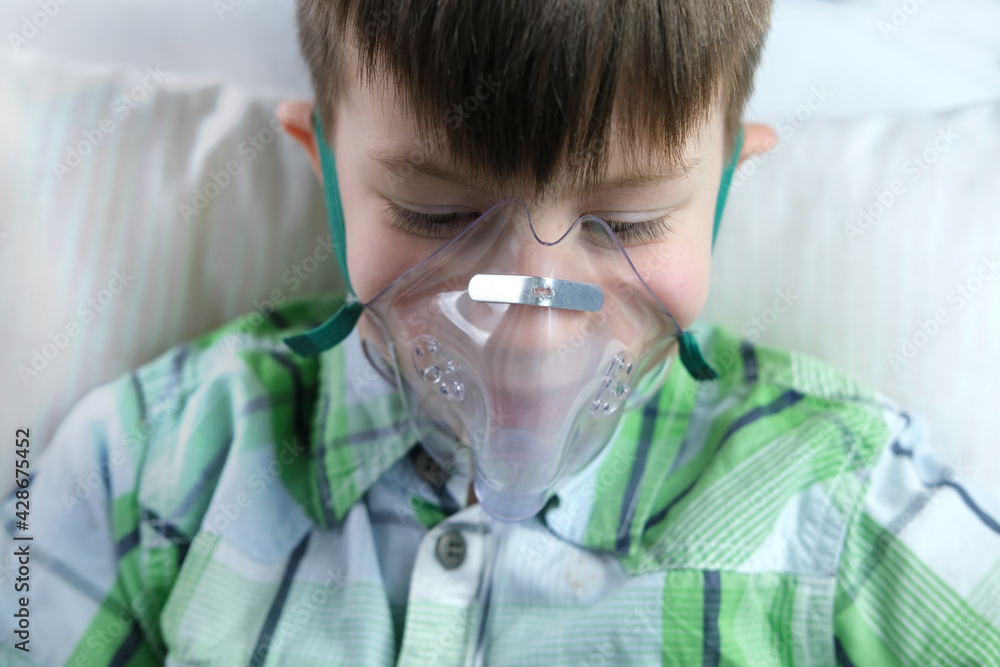 little patient in shirt, child, boy lies, facial oxygen mask, concept ...