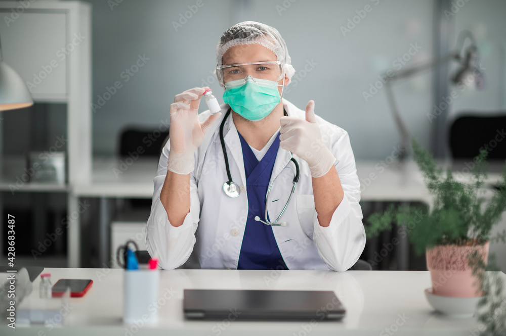 The attractive head of the medical department in his clinic shows the ...