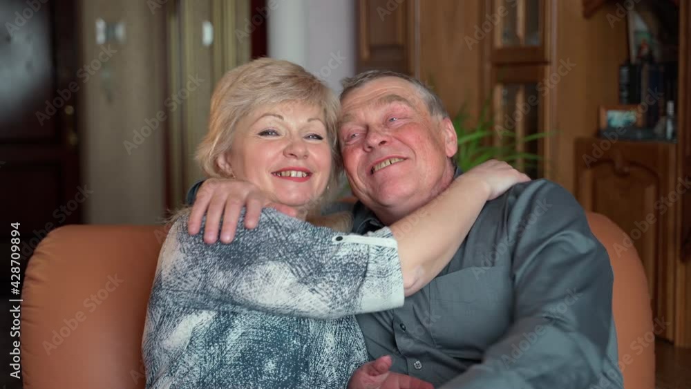 Cheerful old elderly 60s adult family couple hugging laughing bonding ...