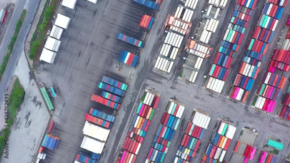 4K Aerial top view over international containers cargo industrial ...