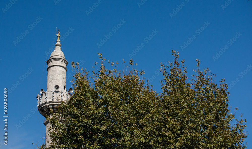 Minaret of a mosque in view. Silhouettes of Mosque Stock Photo | Adobe ...