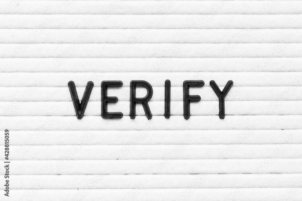 Black color letter in word verify on white felt board background Stock ...