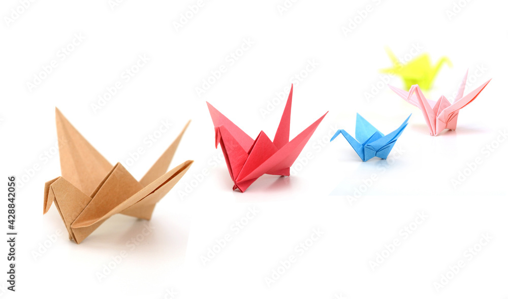 Origami paper birds teamwork on white Stock Photo | Adobe Stock