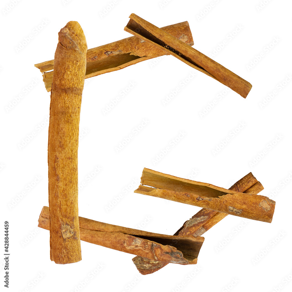 Cinnamon font. Letter G is made from pieces of cinnamon on white ...