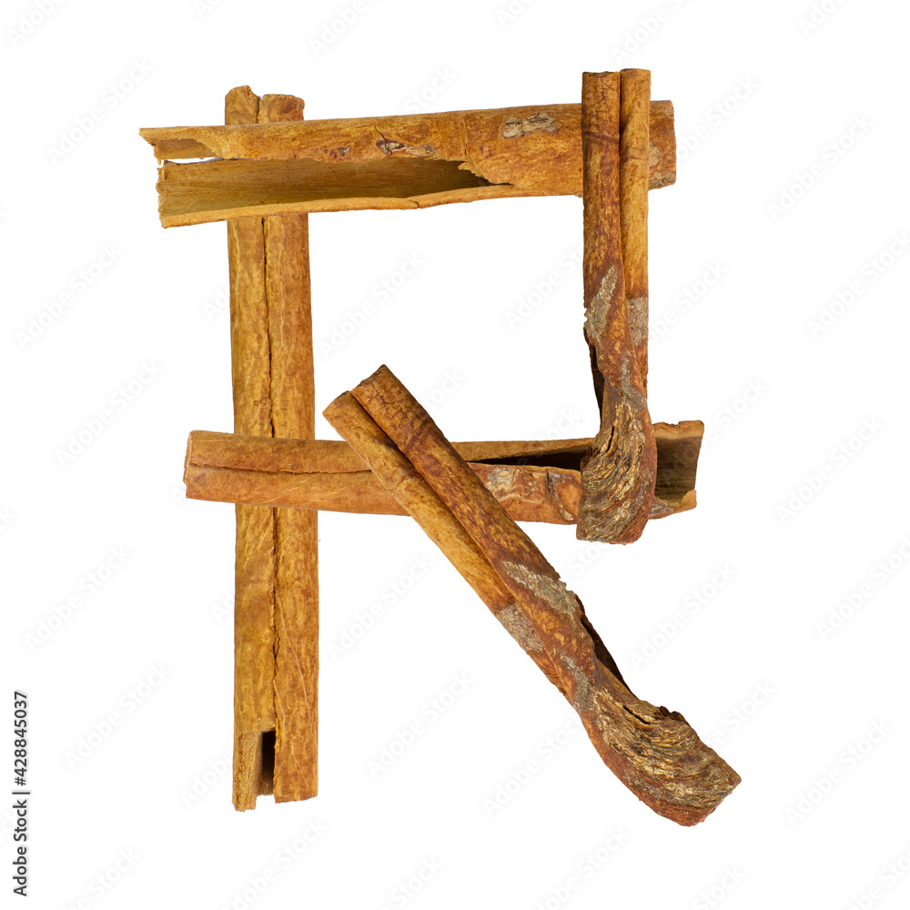 Cinnamon font. Letter R is made from pieces of cinnamon on white ...