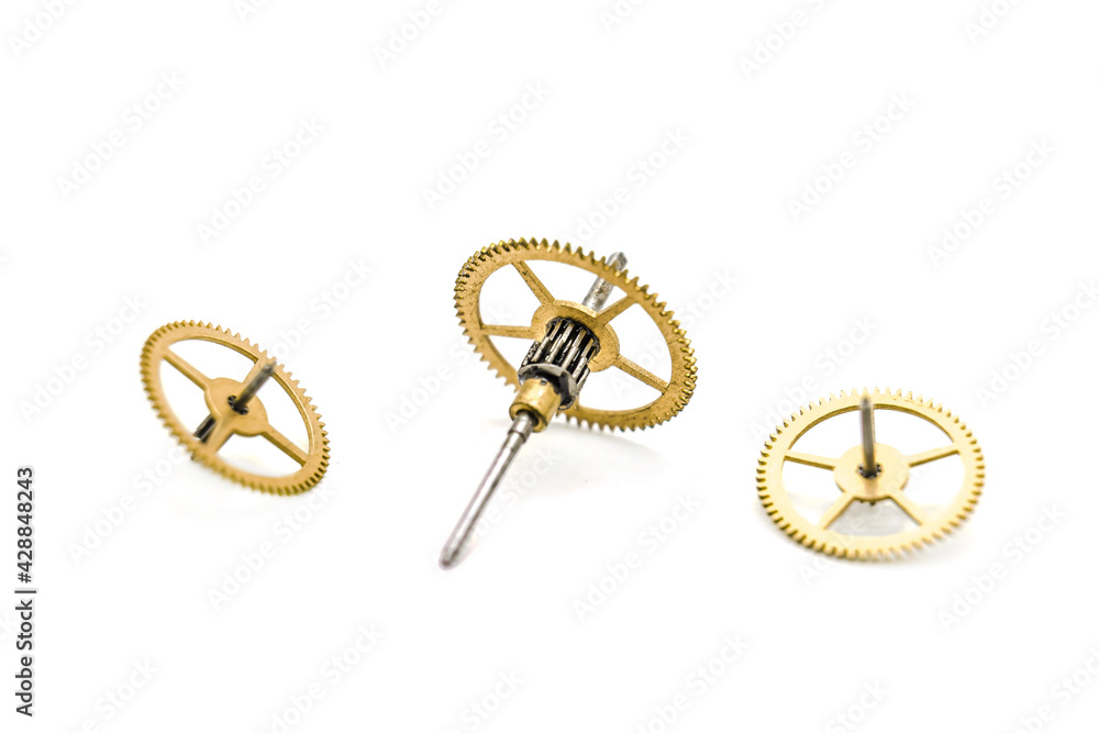 Gears from clock isolated on white background. Photo with shallow depth ...