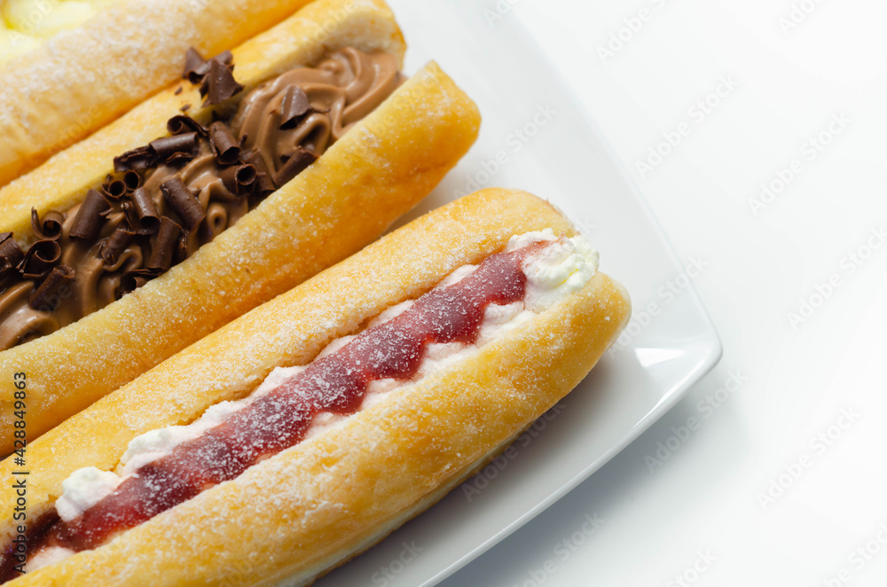 Mixed finger donuts filling chocolate, custard, jam and whipped cream ...