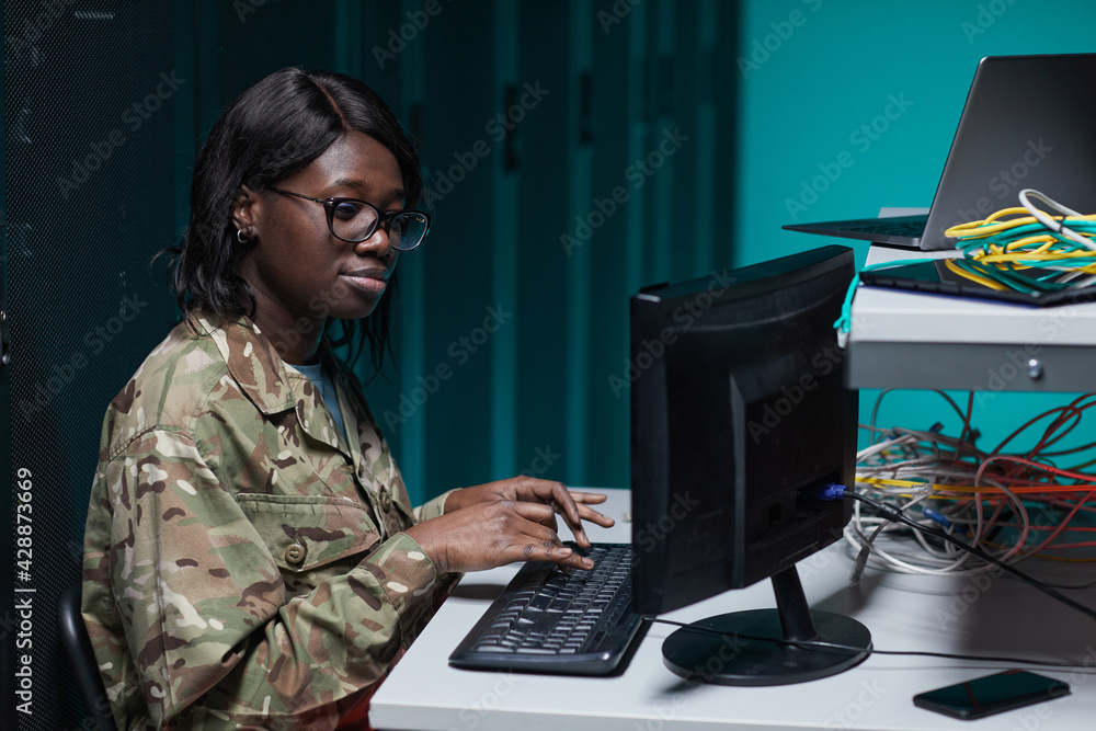 Side view portrait of young African-American woman wearing military ...