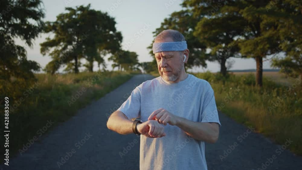 Old male sportsman running using latest innovative technology smart ...