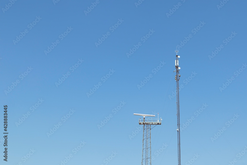 Marine radar and antennas on a blue sky background with free space ...