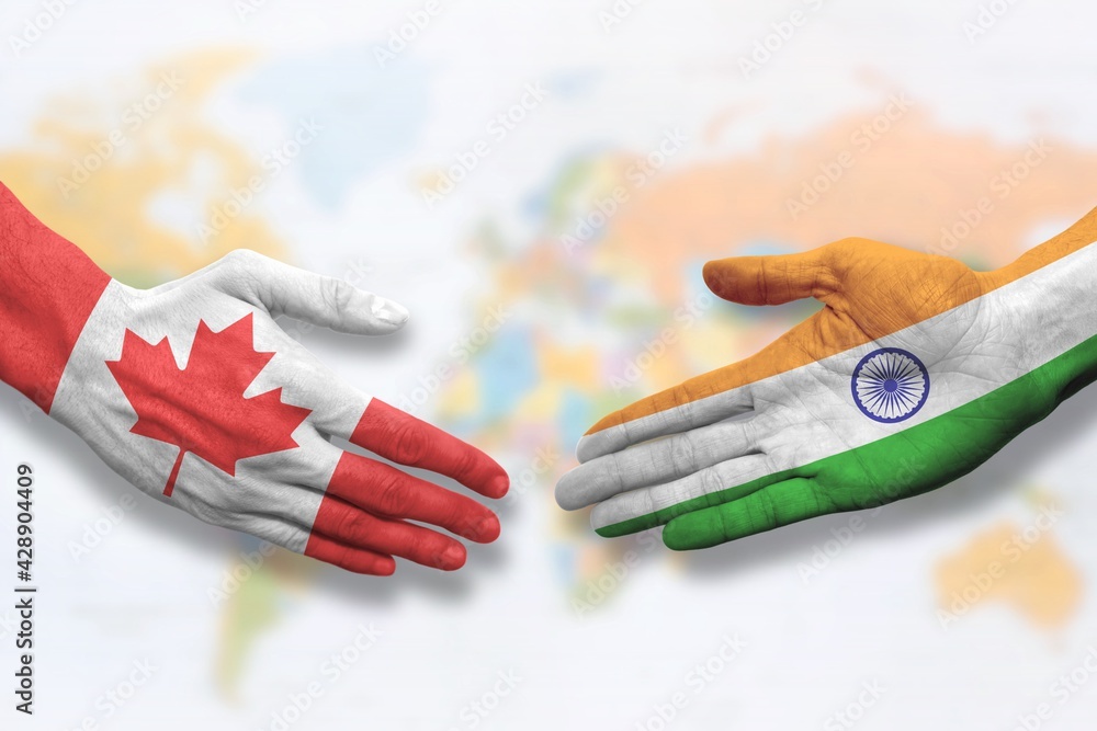 Canada and India - Flag handshake symbolizing partnership and ...