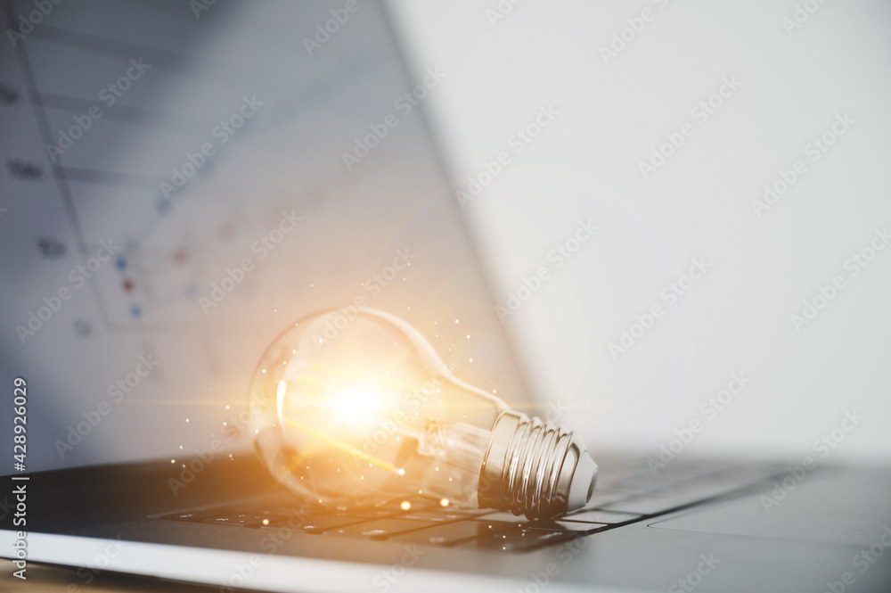 Light bulb putting on computer laptop. Concept of inspiration creative ...