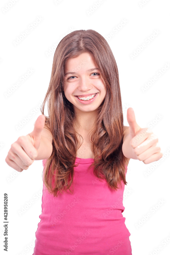 Teen beauty caucasian girl showing her thumbs up. Isolated on white ...