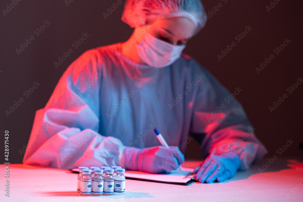 Immunization record. Covid-19 vaccine. Inoculation certificate. Female ...