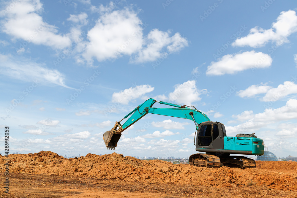 Crawler Excavator digging the soil In the construction site with sky ...