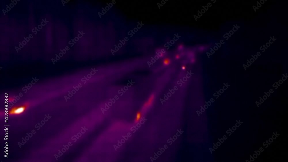 Thermal imaging view of highway road with moving cars. Infrared ...