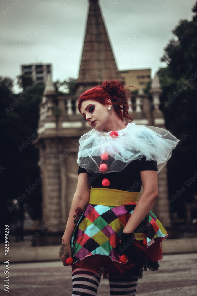 Beautiful young woman dressed as a clown, Beautiful girl dressed as a ...