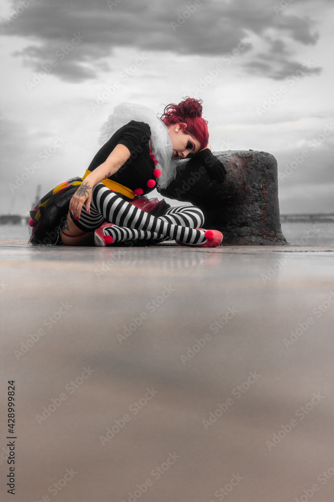 Beautiful young woman dressed as a clown, Beautiful girl dressed as a ...