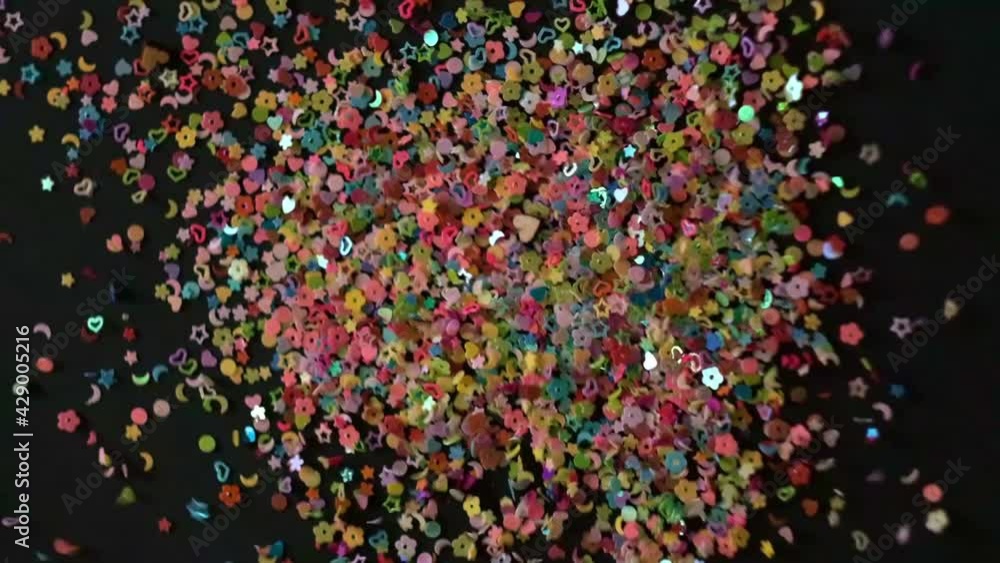 Close up Confetti explosion on black background. Slow Motion confetti ...