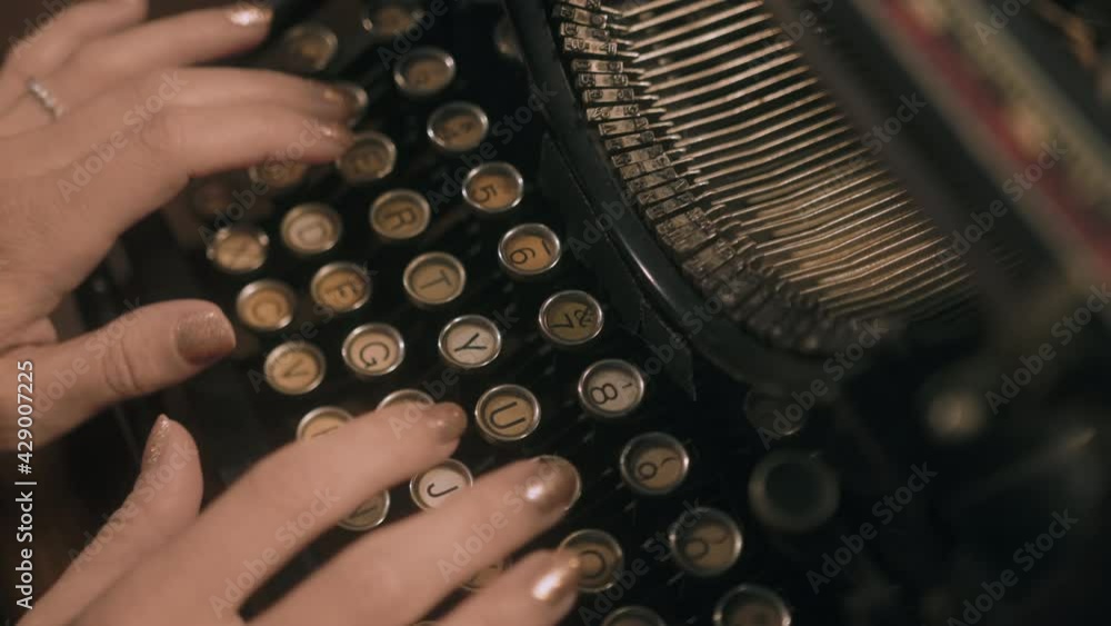 Top down shot of woman's hands typing on vintage typewriter - slide ...