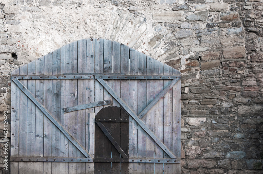 gate to the ancient castle. gate in a medieval tower. closed access ...