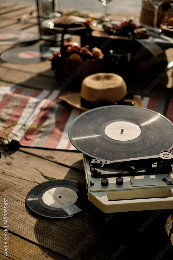 Vintage turntable and gramophone records on the background of a ...