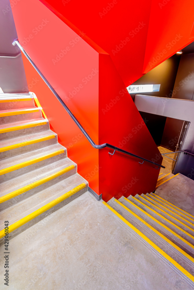 Staircase painted in red. Abstract fragment of the architecture of ...