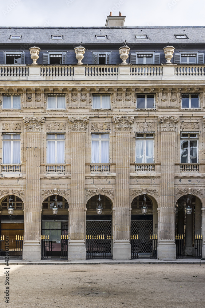 Architecture of ancient buildings in public garden of Palais-Royal ...