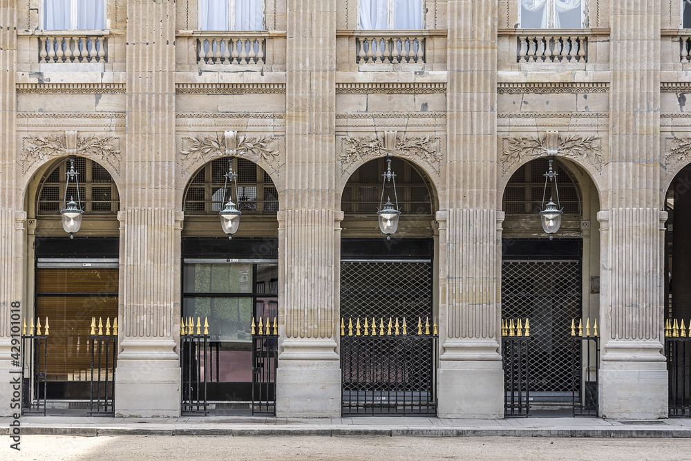 Architecture of ancient buildings in public garden of Palais-Royal ...