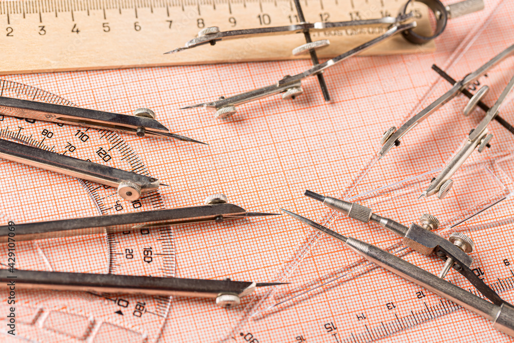 Drawing tools, ruler and protractor on graph paper. Close up Stock ...