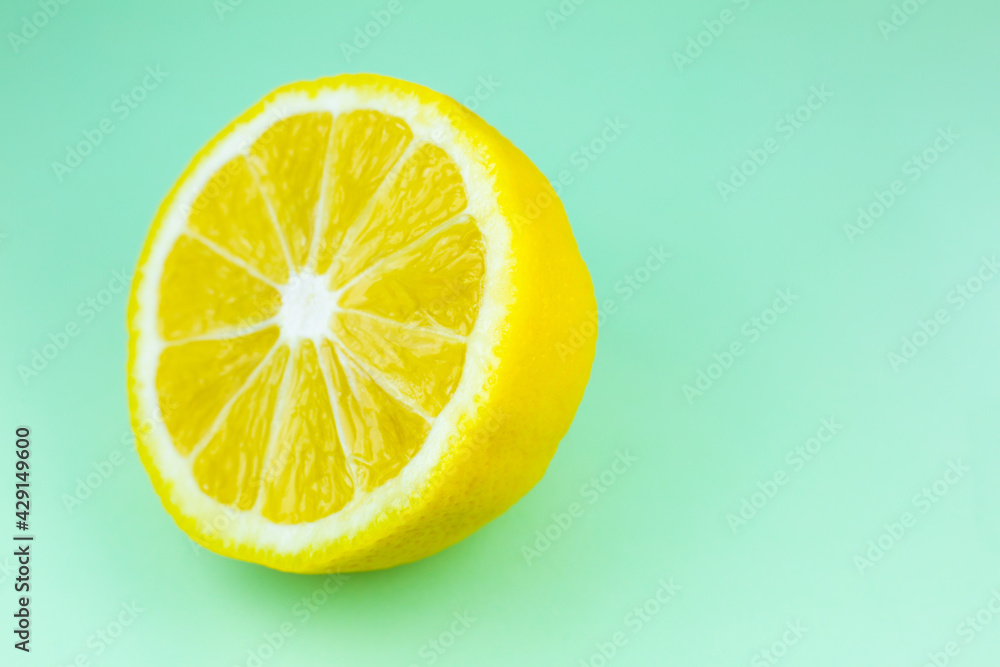 Close up photo of lemon texture on the blue background. Fruit cut in ...