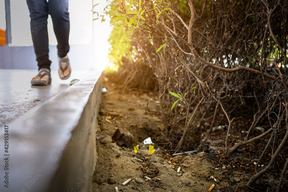 People throw trash on street beside the sidewalk,discarded garbage ...