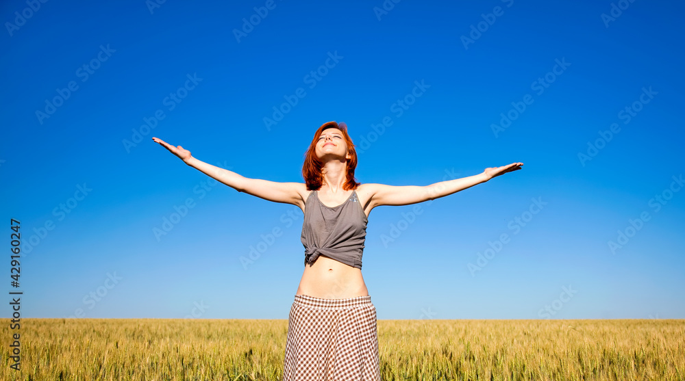 Beautiful young irl at green field Stock Photo | Adobe Stock