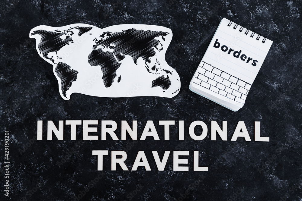 world map with International Travel text and Borders message on notepad ...