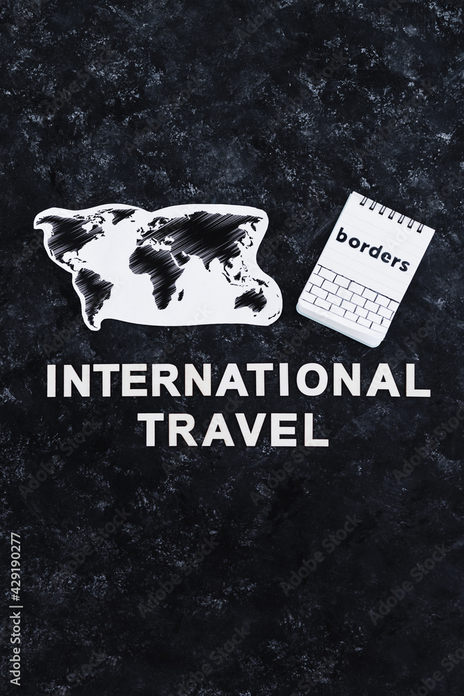 world map with International Travel text and Borders message on notepad ...