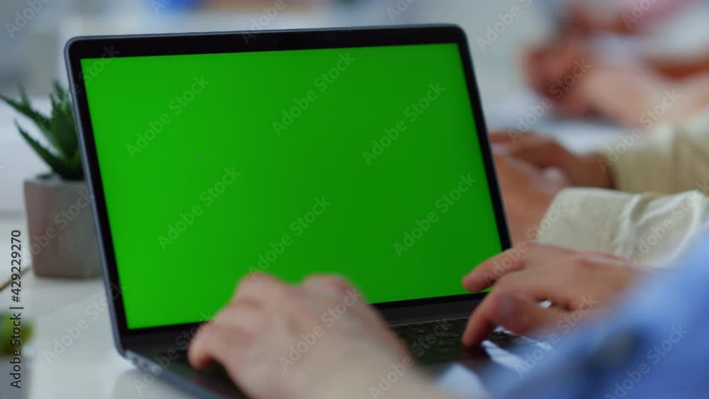 Man hands typing green screen laptop office. Unknown male person using ...