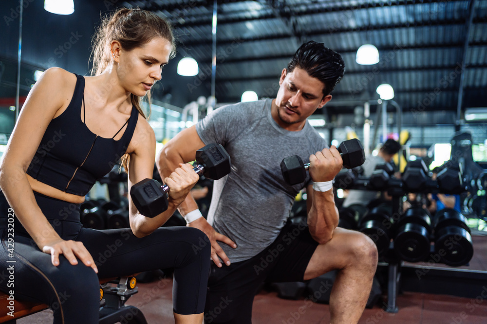 Coaching Woman Basic Workout Exercise in Fitness Gym Weight Training ...