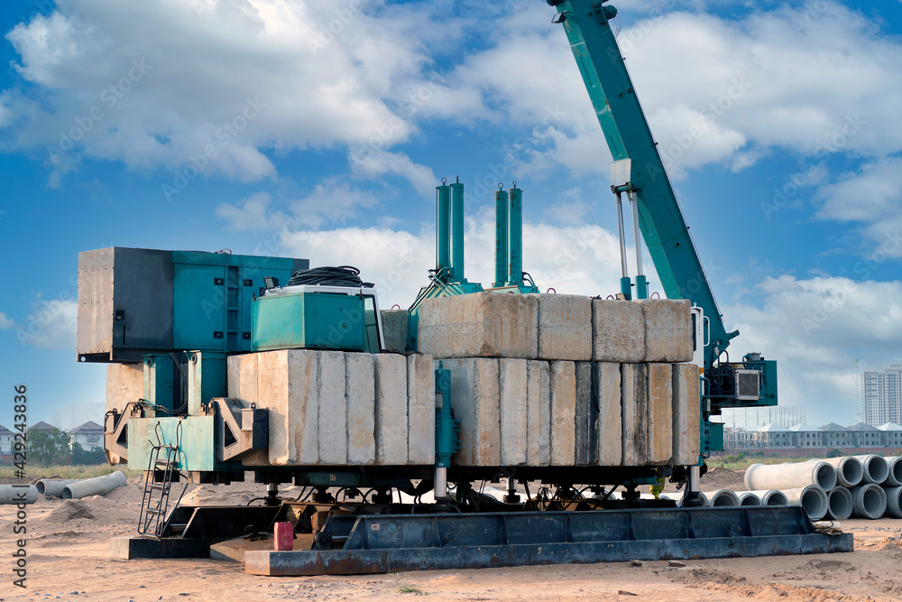 Heavy cement blocks used as counterweights to balance a heavy lifting ...