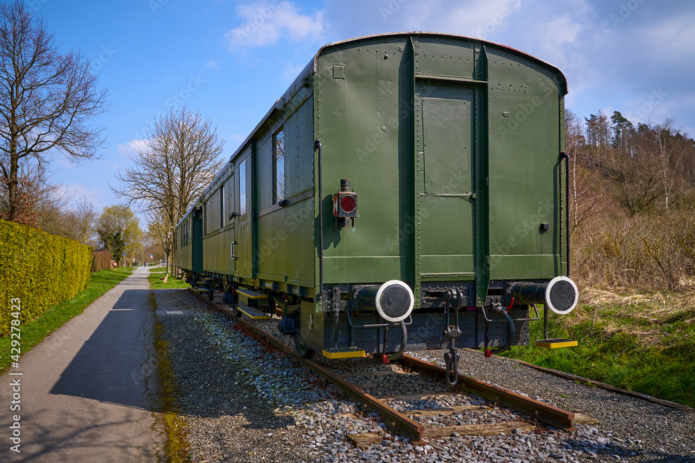 Oldtimer Train with steam engine from behind on a small track near ...